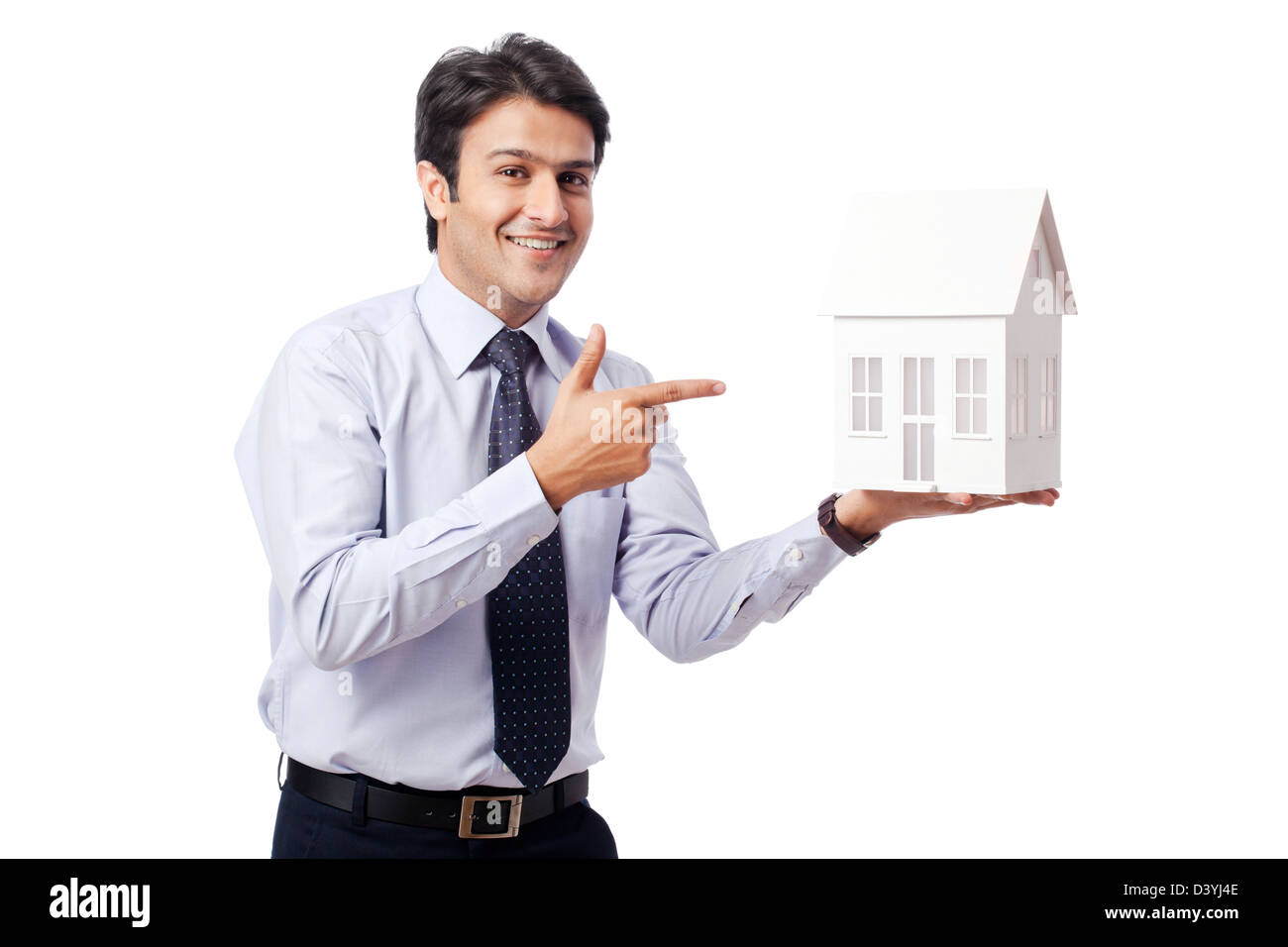 Businessman pointing towards model home Cut Out Stock Images & Pictures ...