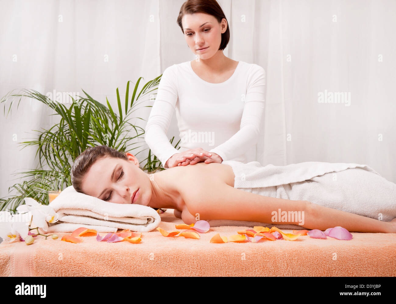 young attractive smiling woman doing wellness spa relaxing massage ...