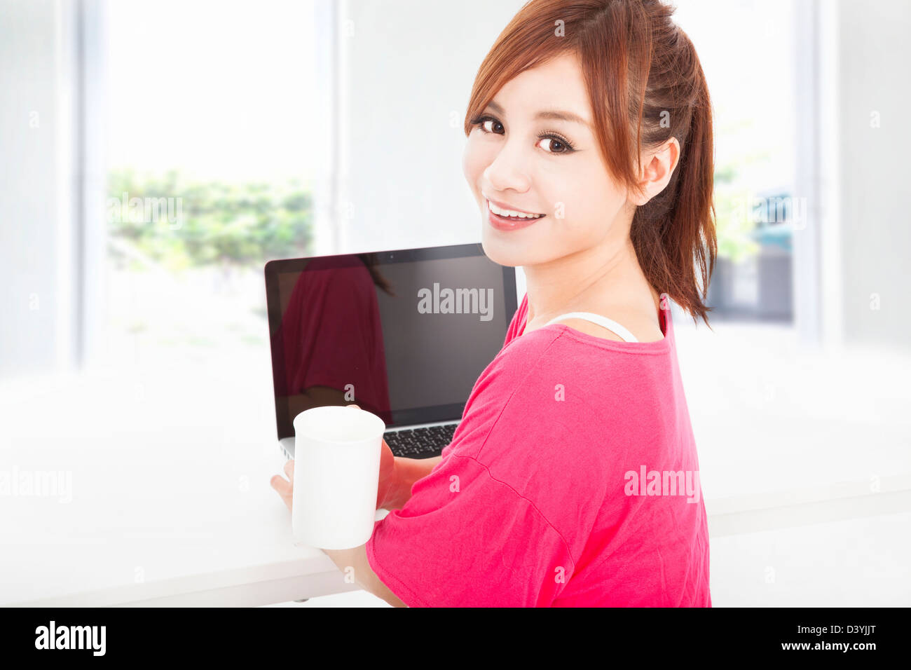 happy asian woman sitting with laptop computer Stock Photo - Alamy