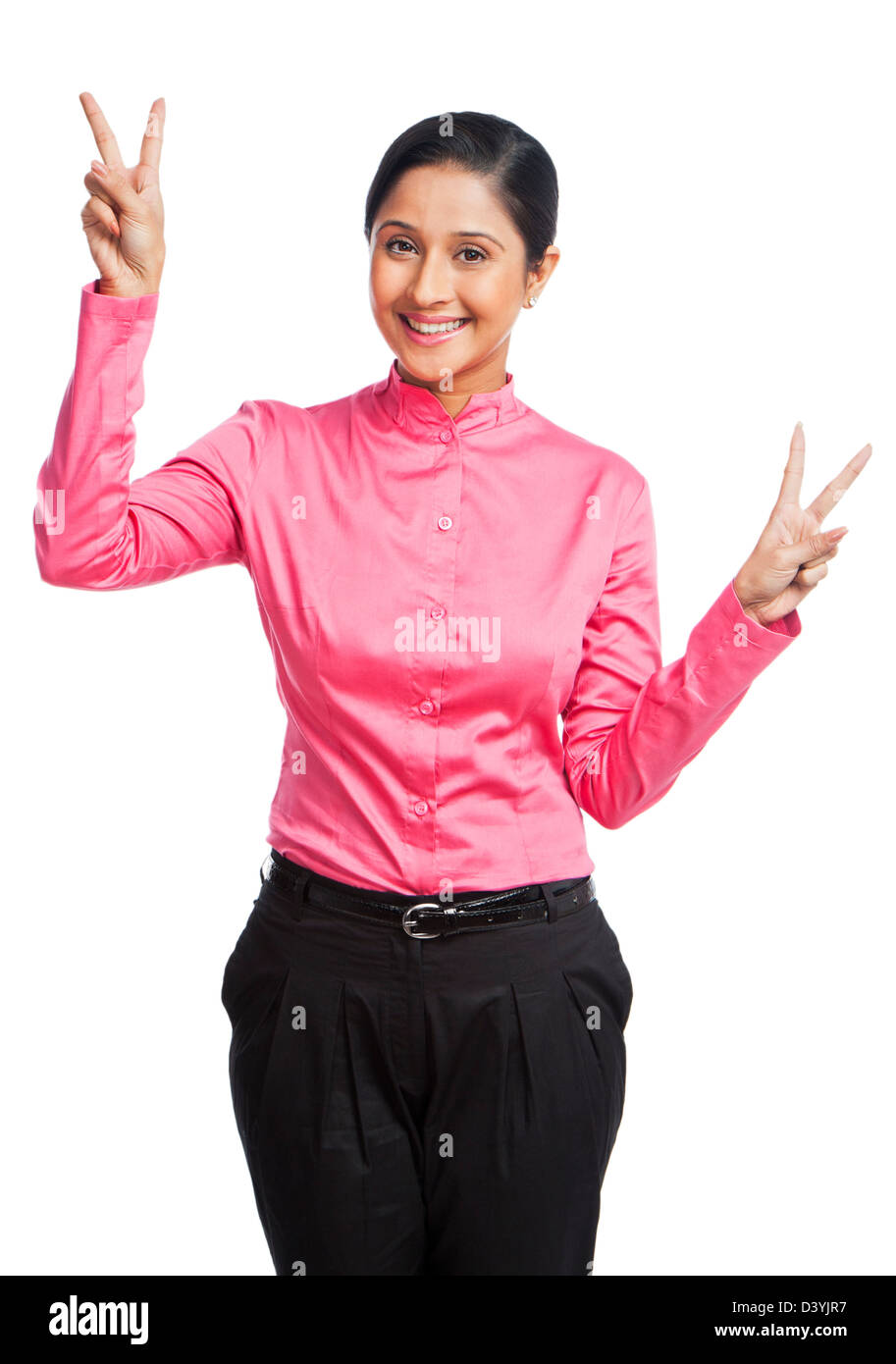 Portrait of a businesswoman gesturing victory sign Stock Photo - Alamy