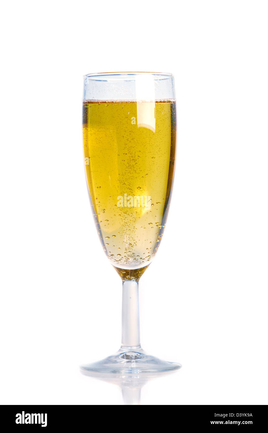 Closeup of the bubbles in a glass of champagne on white background ...