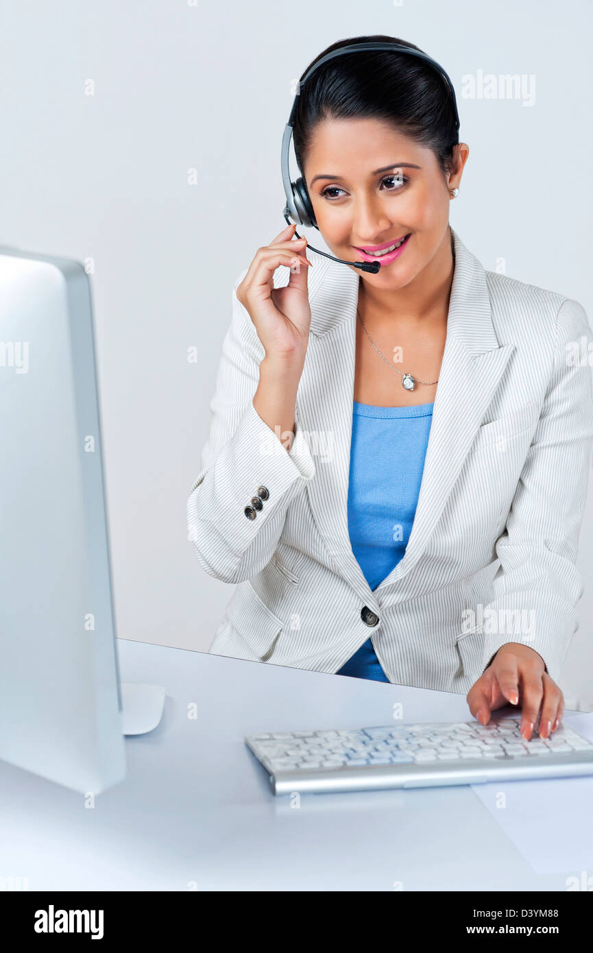 Female customer service representative using a desktop pc Stock Photo ...