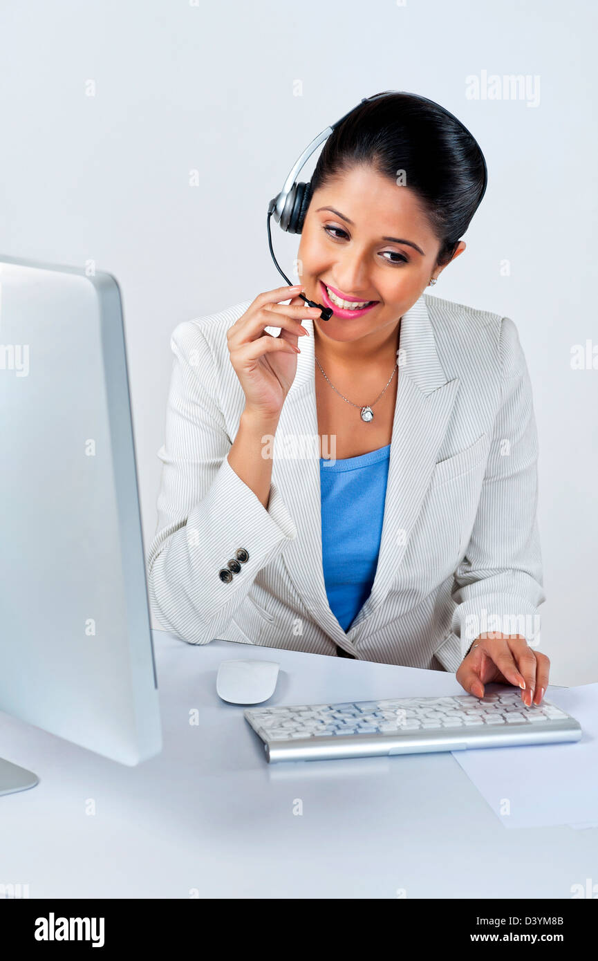 Female customer service representative using a desktop pc Stock Photo ...