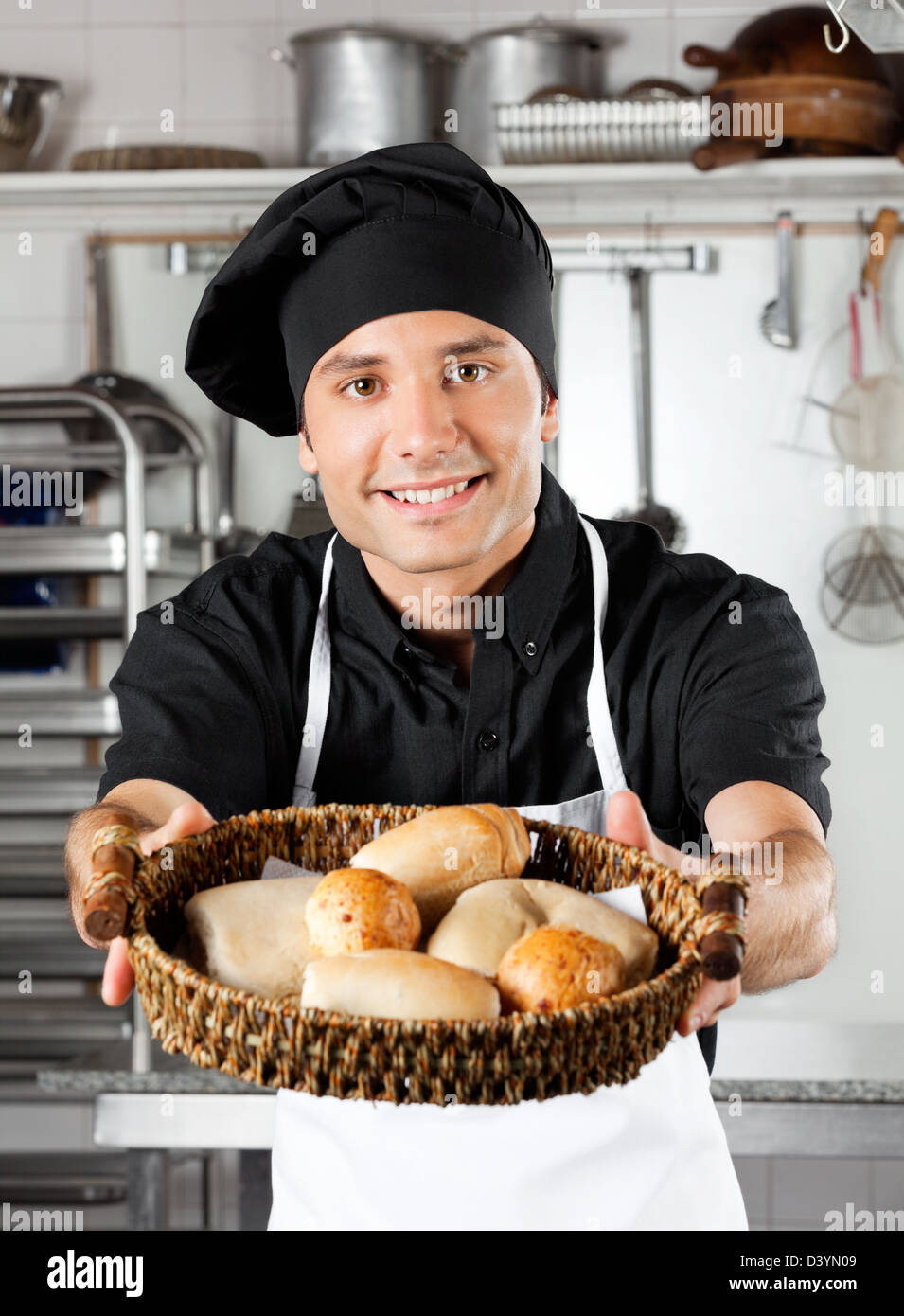 Male Chef Offering Breads In Kitchen Stock Photo - Alamy
