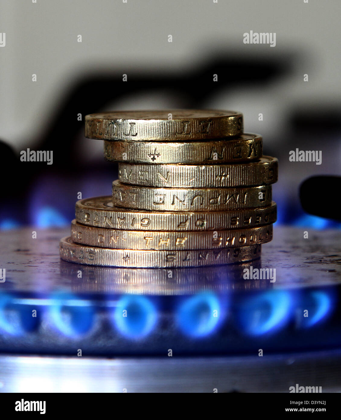 Lots of coin around a gas burner on a cooker. The owner of British Gas ...