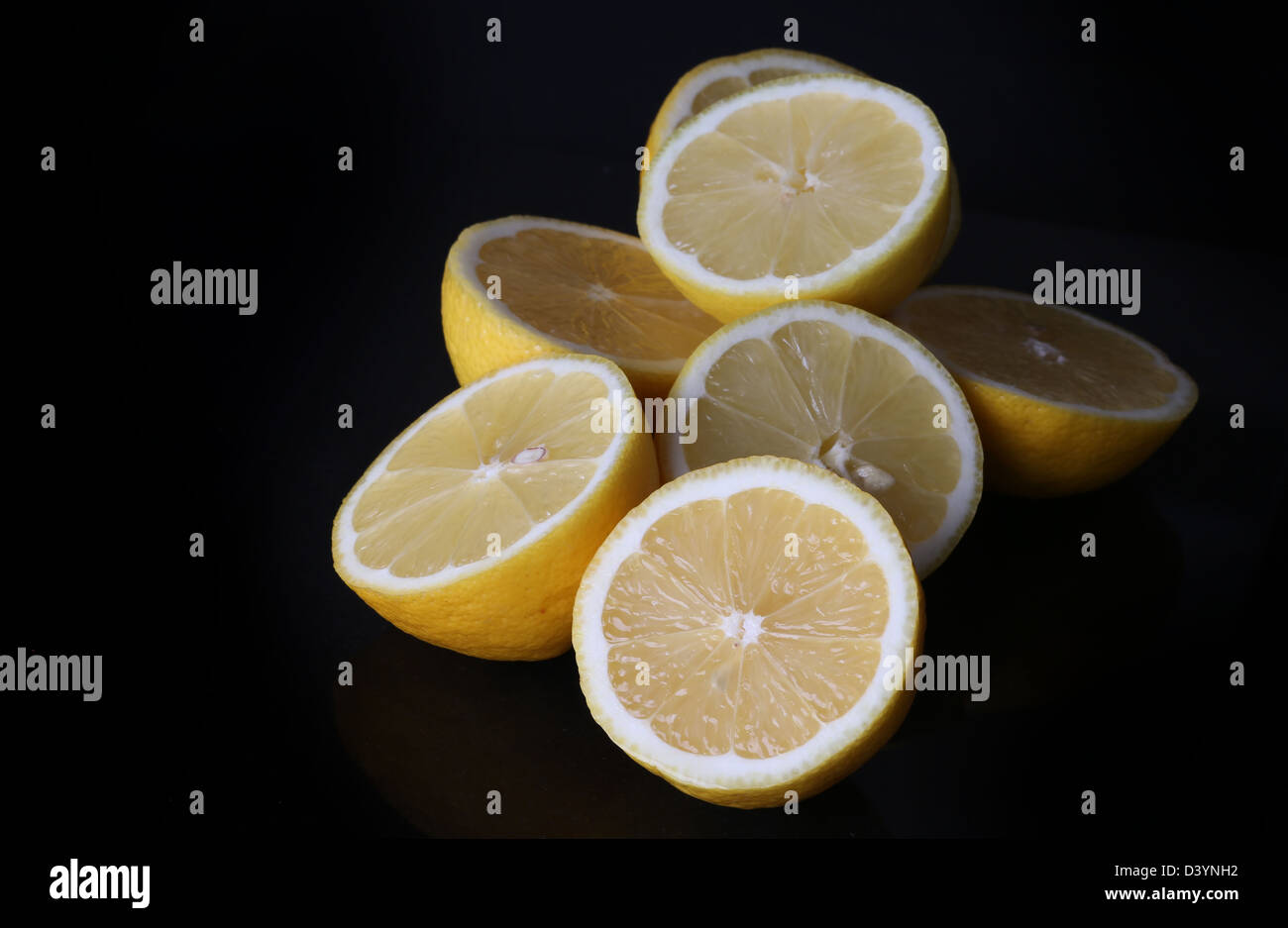 Fresh Lemons cut in half Stock Photo - Alamy