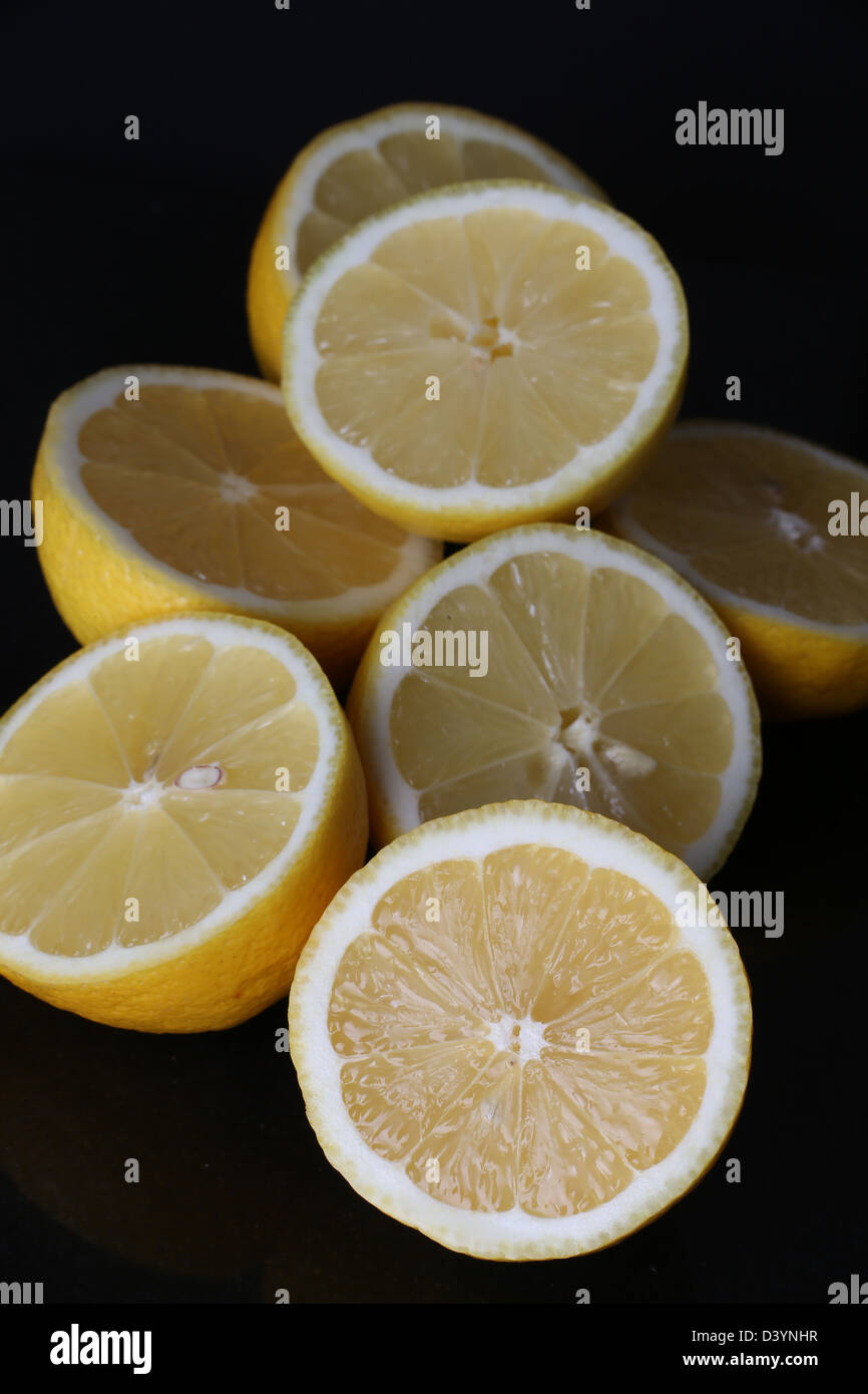 Fresh Lemons cut in half Stock Photo - Alamy
