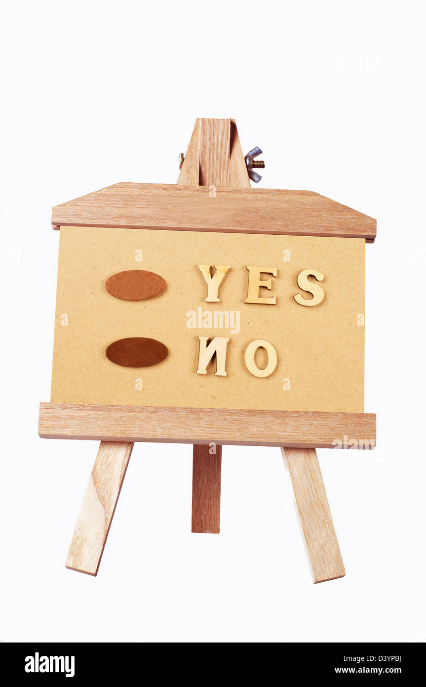 Wood carving, yes and no on the message board Stock Photo - Alamy