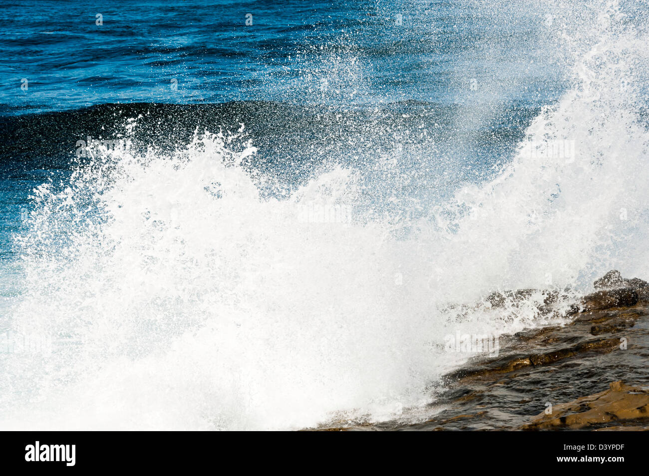 Pacific Ocean Wave Crashing Onto Rocks Creating White Surf and Spray at ...