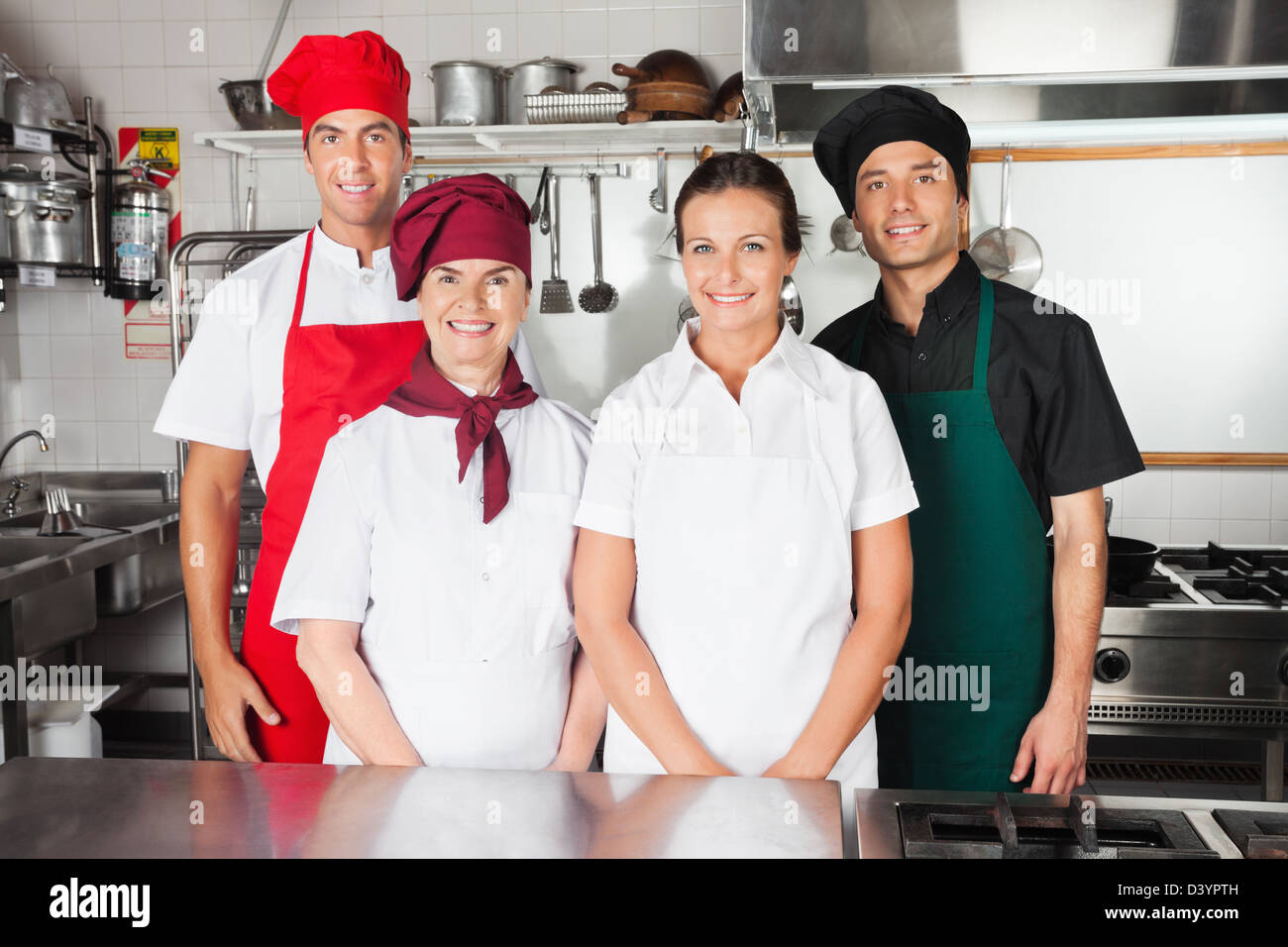Happy Chefs In Kitchen Stock Photo - Alamy