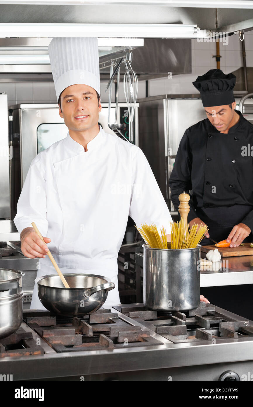 Happy Chef Cooking Food Stock Photo - Alamy