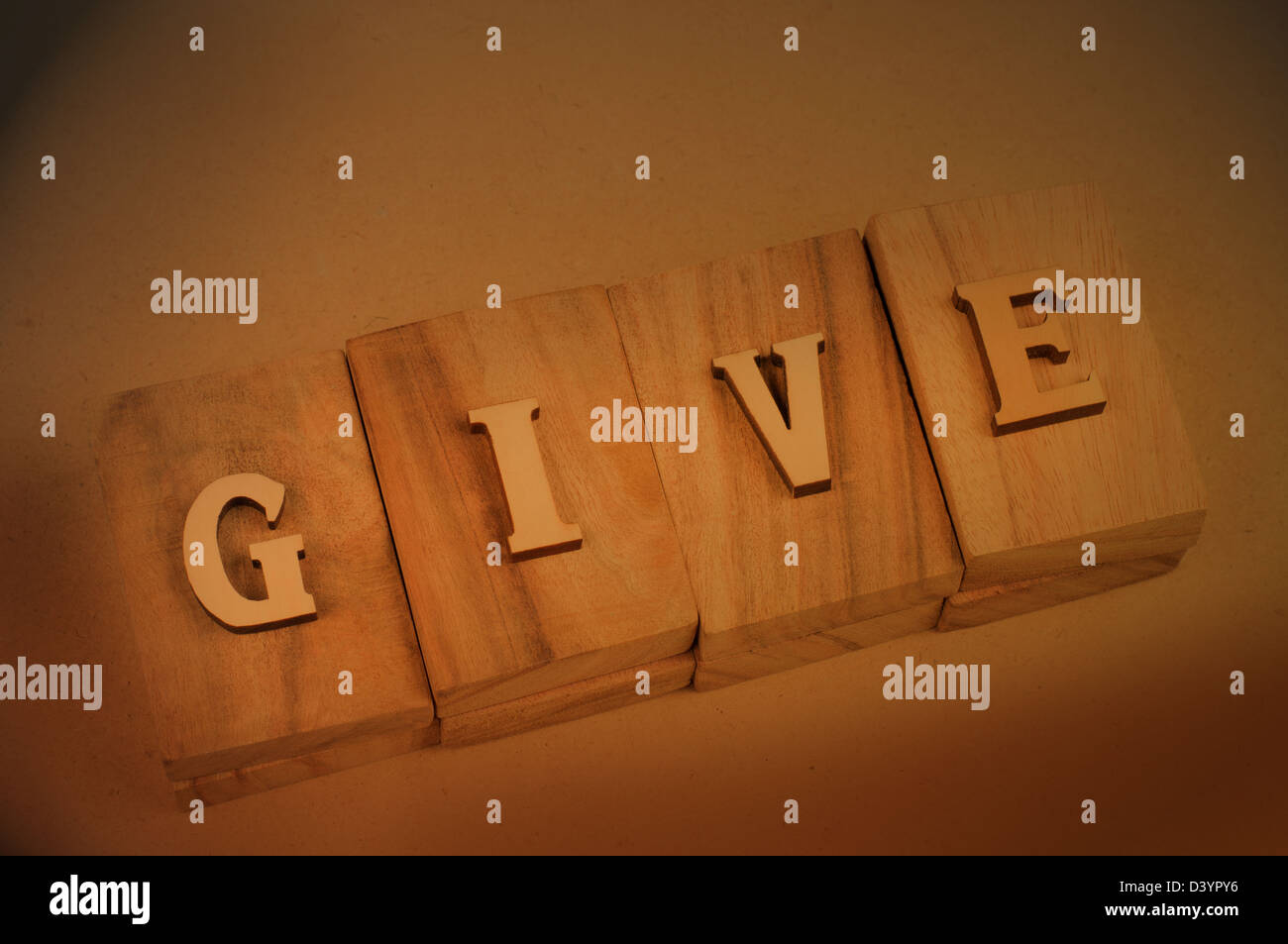 Cutting letters on a square block Stock Photo - Alamy