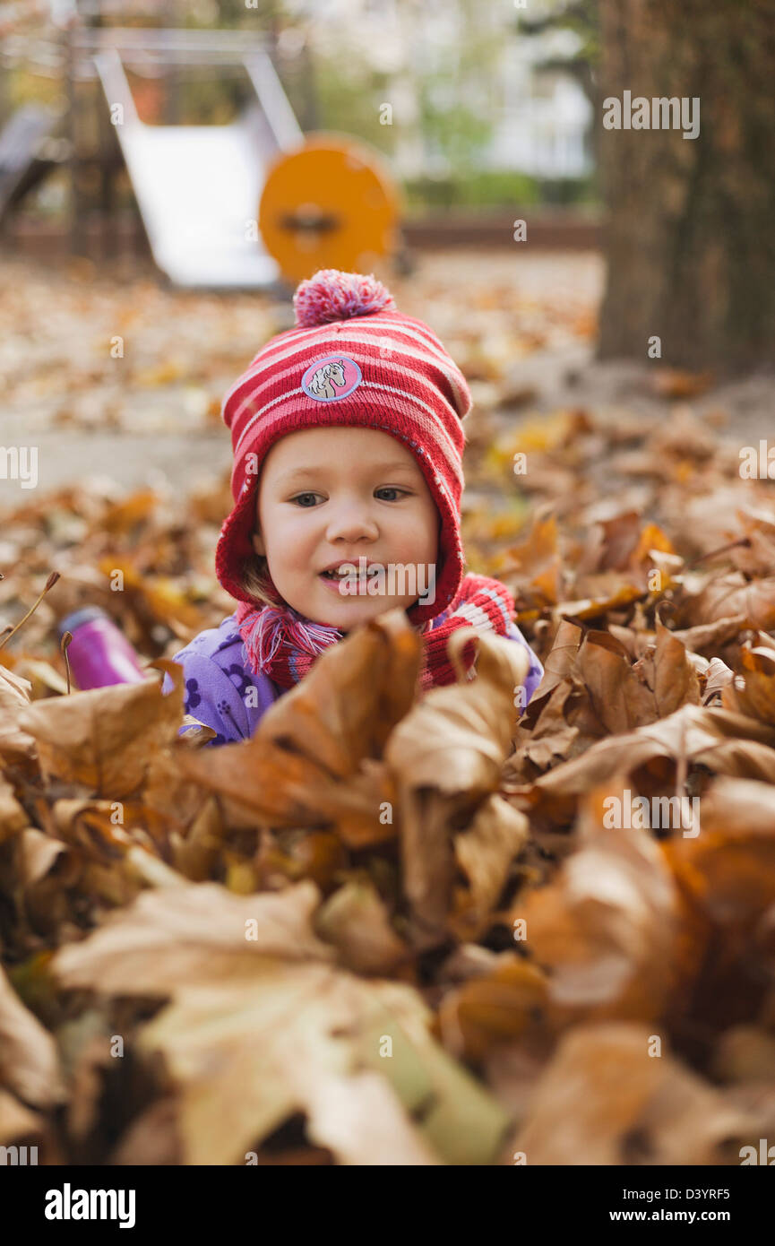 Girl in Fall Leaves, Germany Stock Photo - Alamy