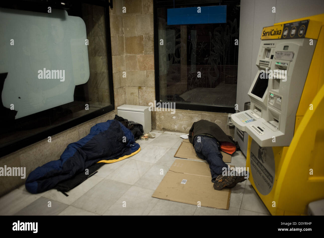 People sleeping inside of an ATM Stock Photo - Alamy