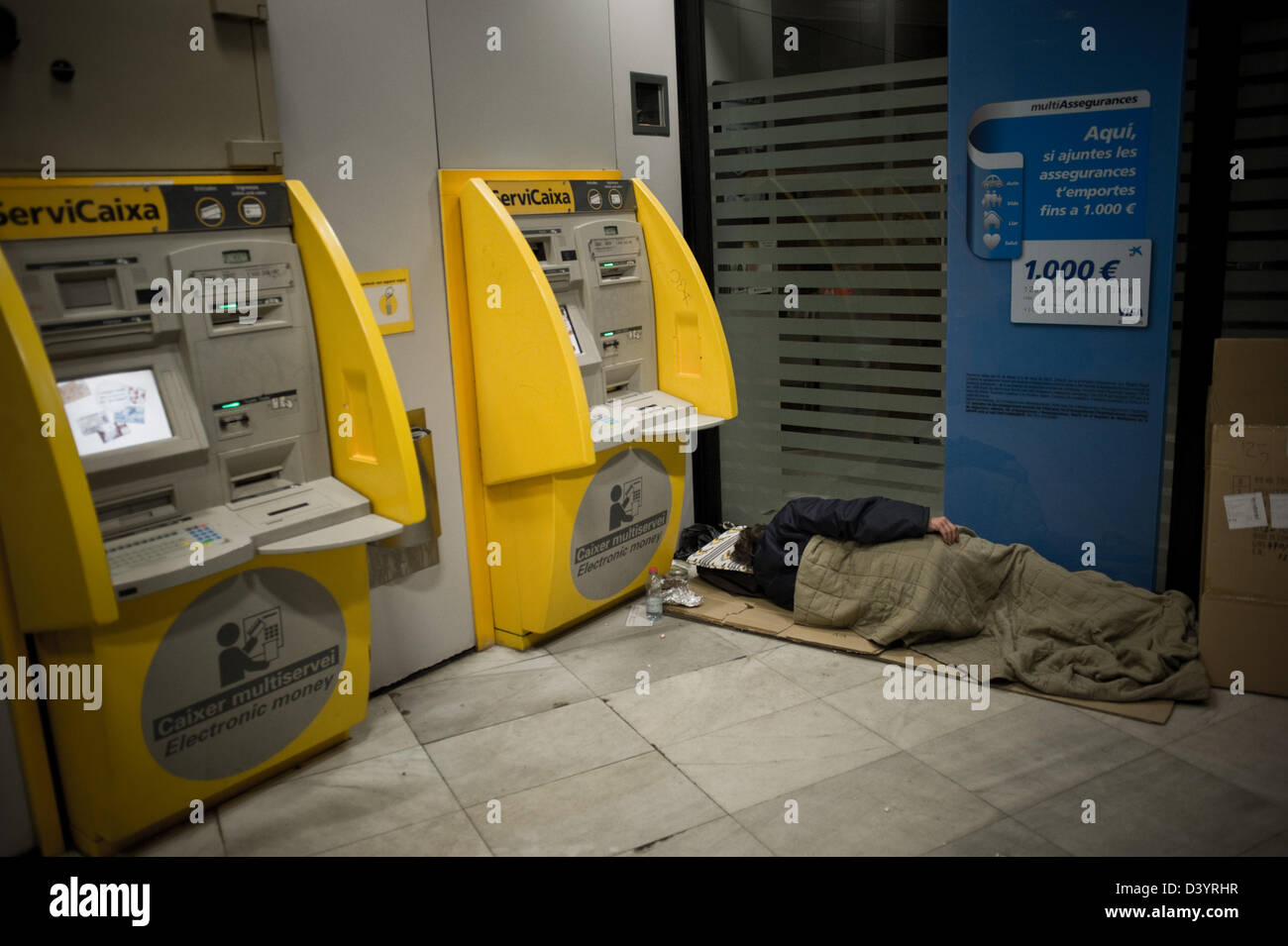 People sleeping inside of an ATM Stock Photo - Alamy