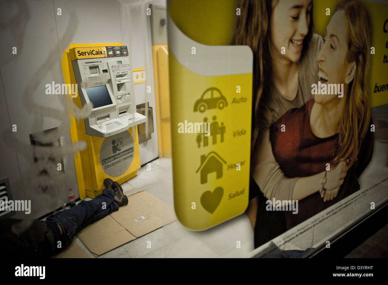 People sleeping inside of an ATM Stock Photo - Alamy
