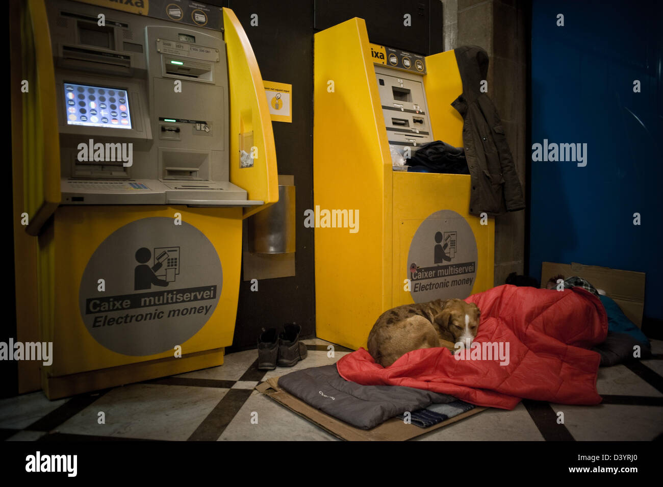 People sleeping inside of an ATM Stock Photo - Alamy
