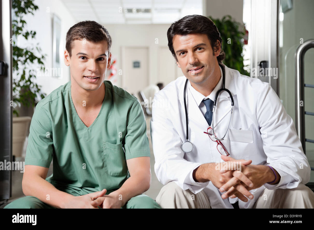 Medical Coworkers Sitting Together Stock Photo - Alamy