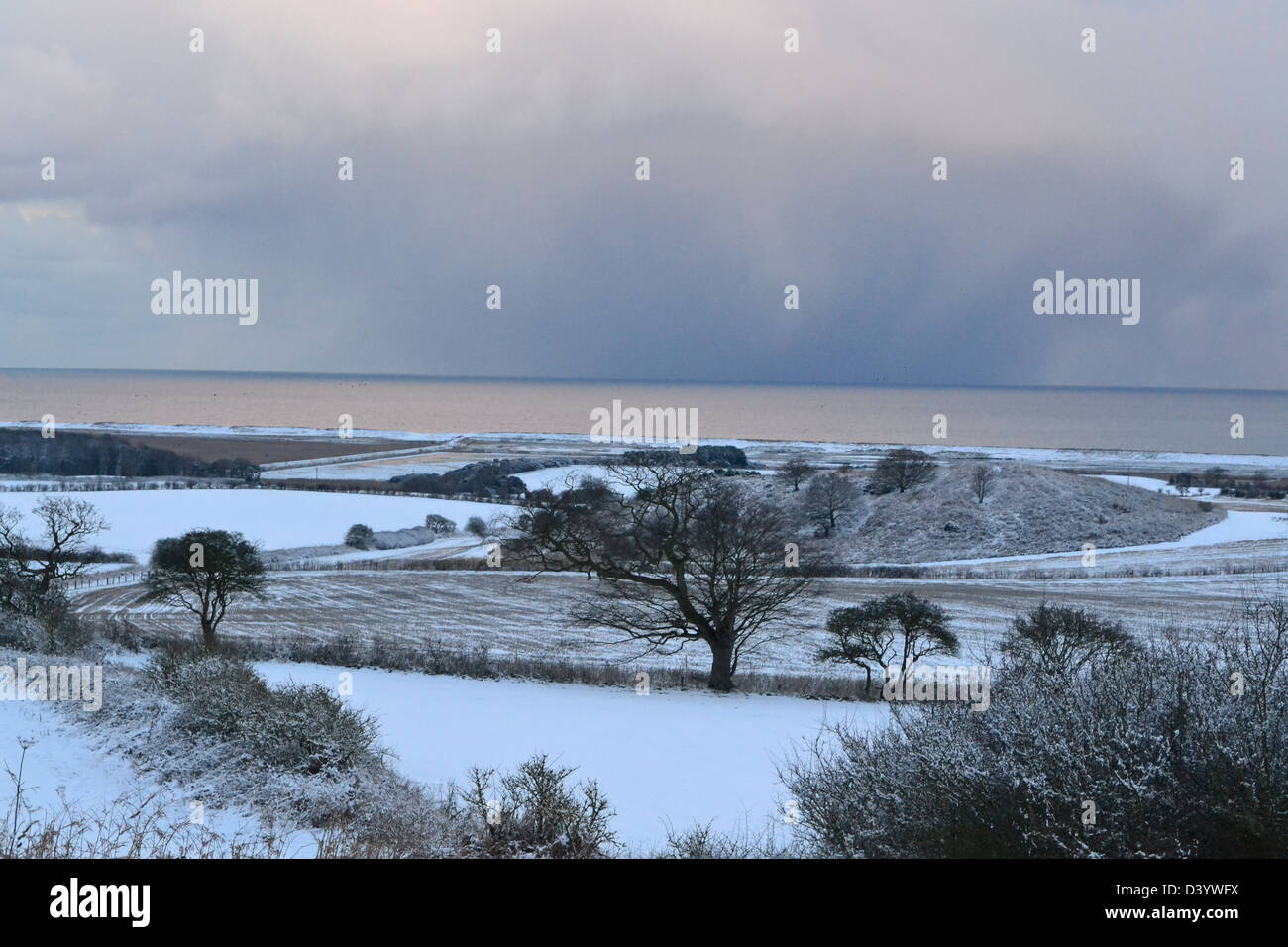 Snowy landscape overlooking sea Stock Photo - Alamy