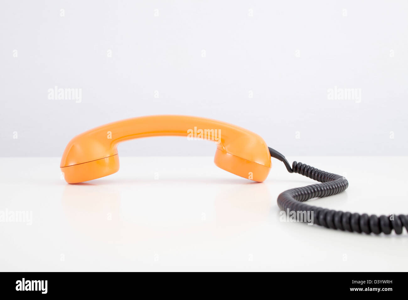 Orange Telephone Receiver Stock Photo - Alamy
