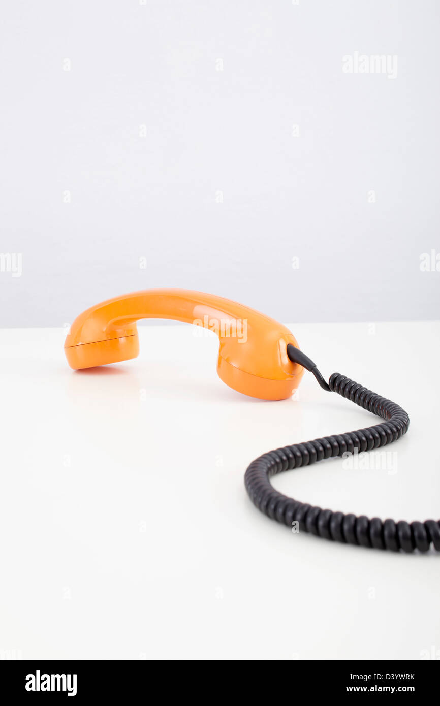 Orange Telephone Receiver Stock Photo - Alamy