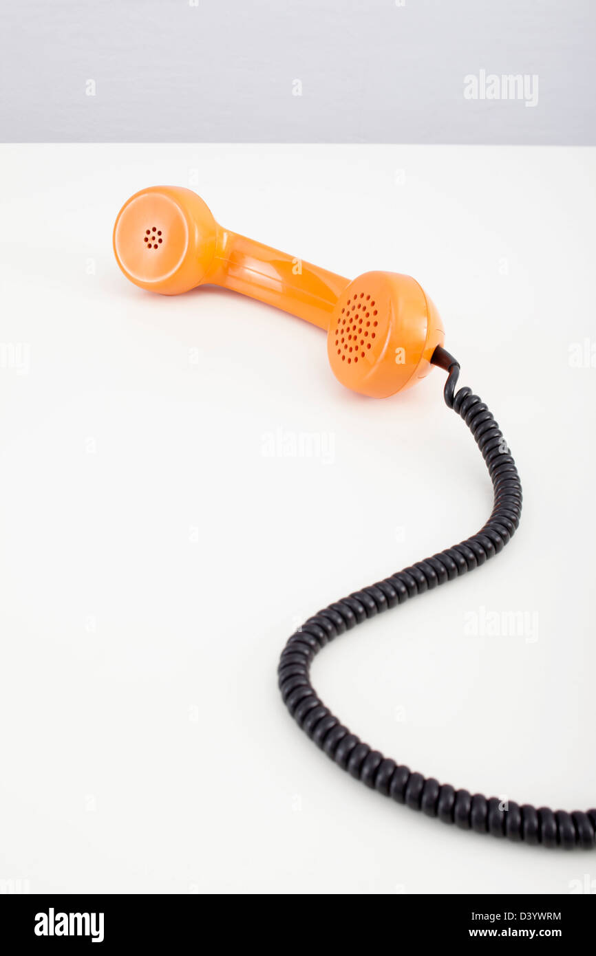 Orange Telephone Receiver Stock Photo - Alamy