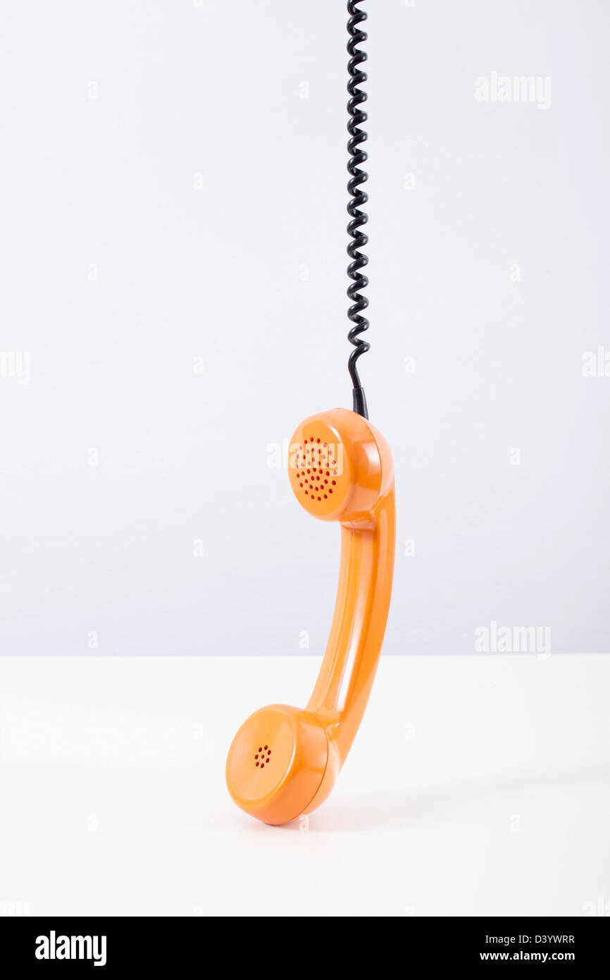 Orange Telephone Receiver Stock Photo - Alamy