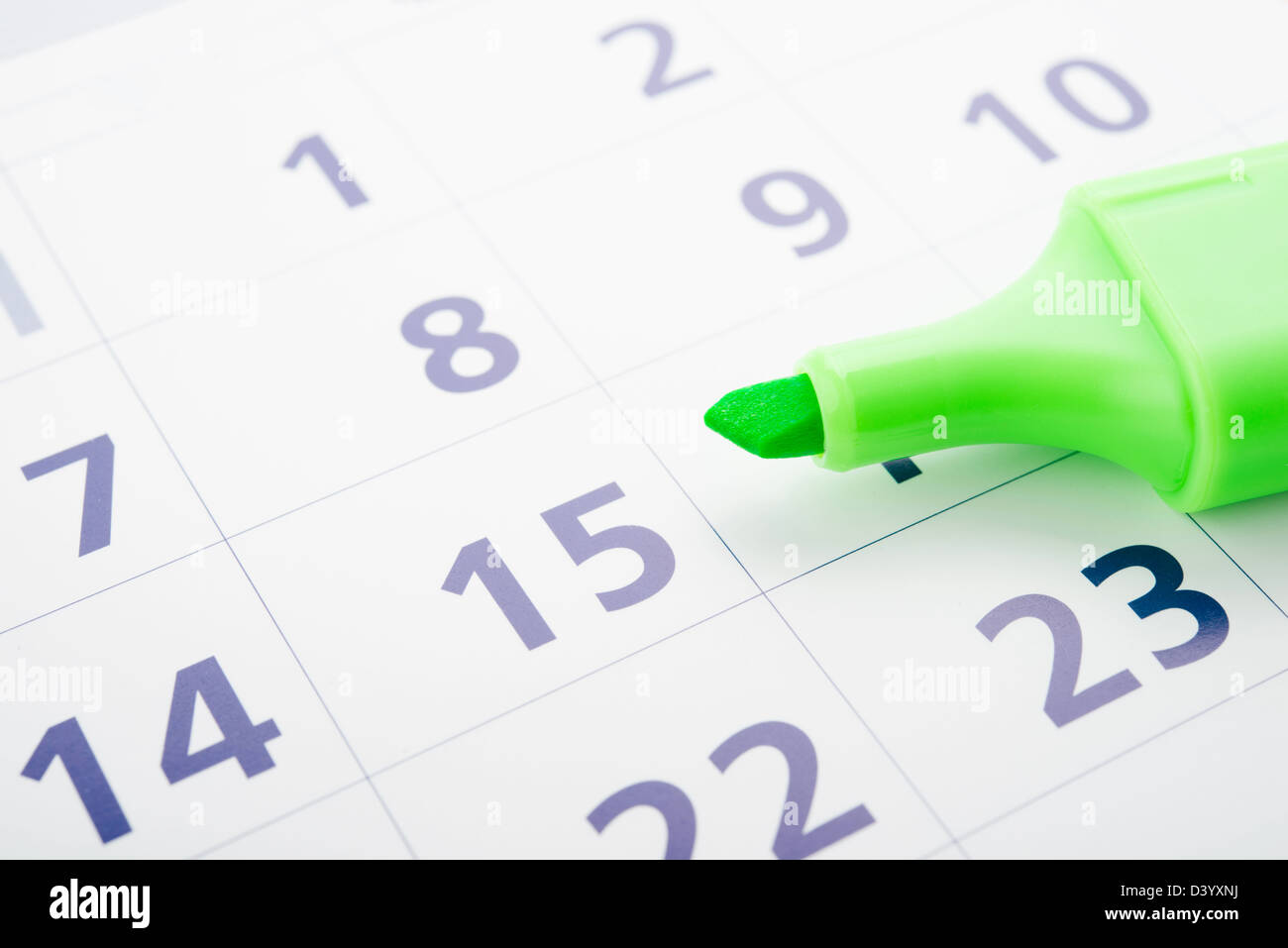 Green marker and open calendar Stock Photo - Alamy