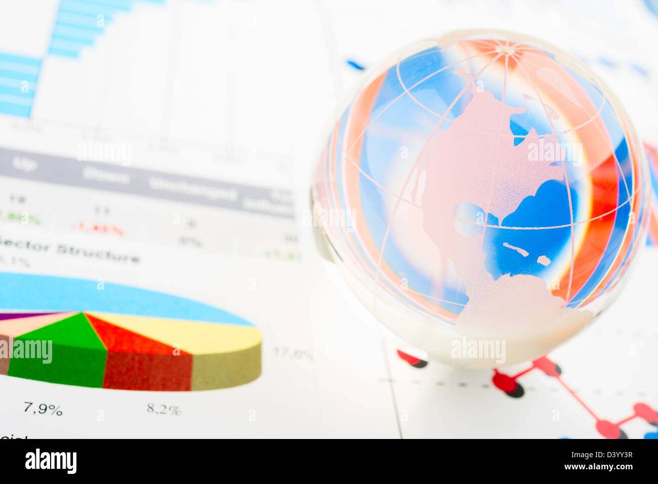 Global year report with glass globe and pen Stock Photo - Alamy