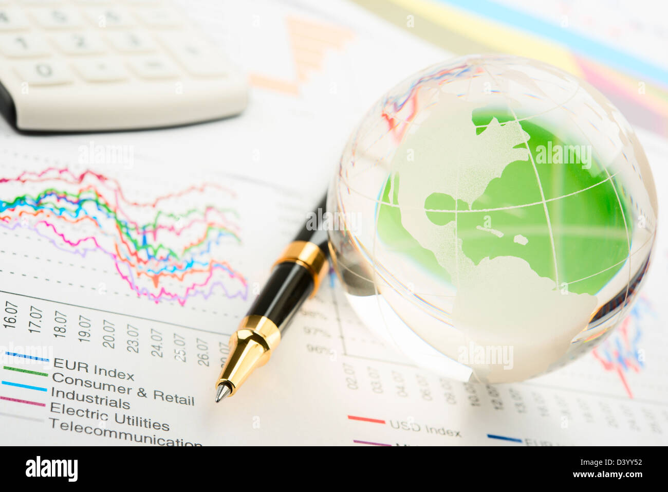 Global year report with glass globe and pen Stock Photo - Alamy