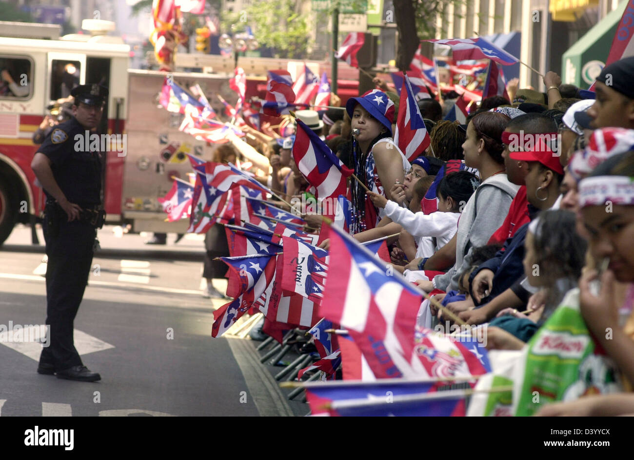 Spectators wave flags and cheer at the 45th Annual Puerto Rican Day ...