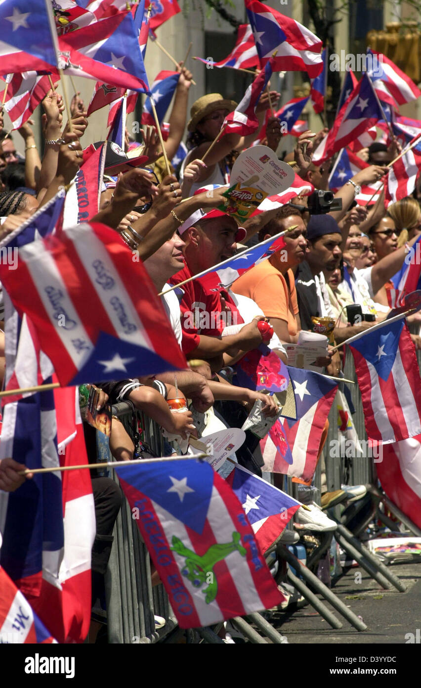 Spectators wave flags and cheer at the 45th Annual Puerto Rican Day ...