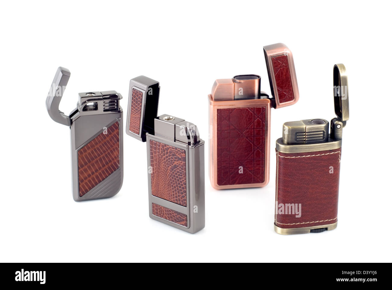 Four lighters with open covers are photographed on a white background ...