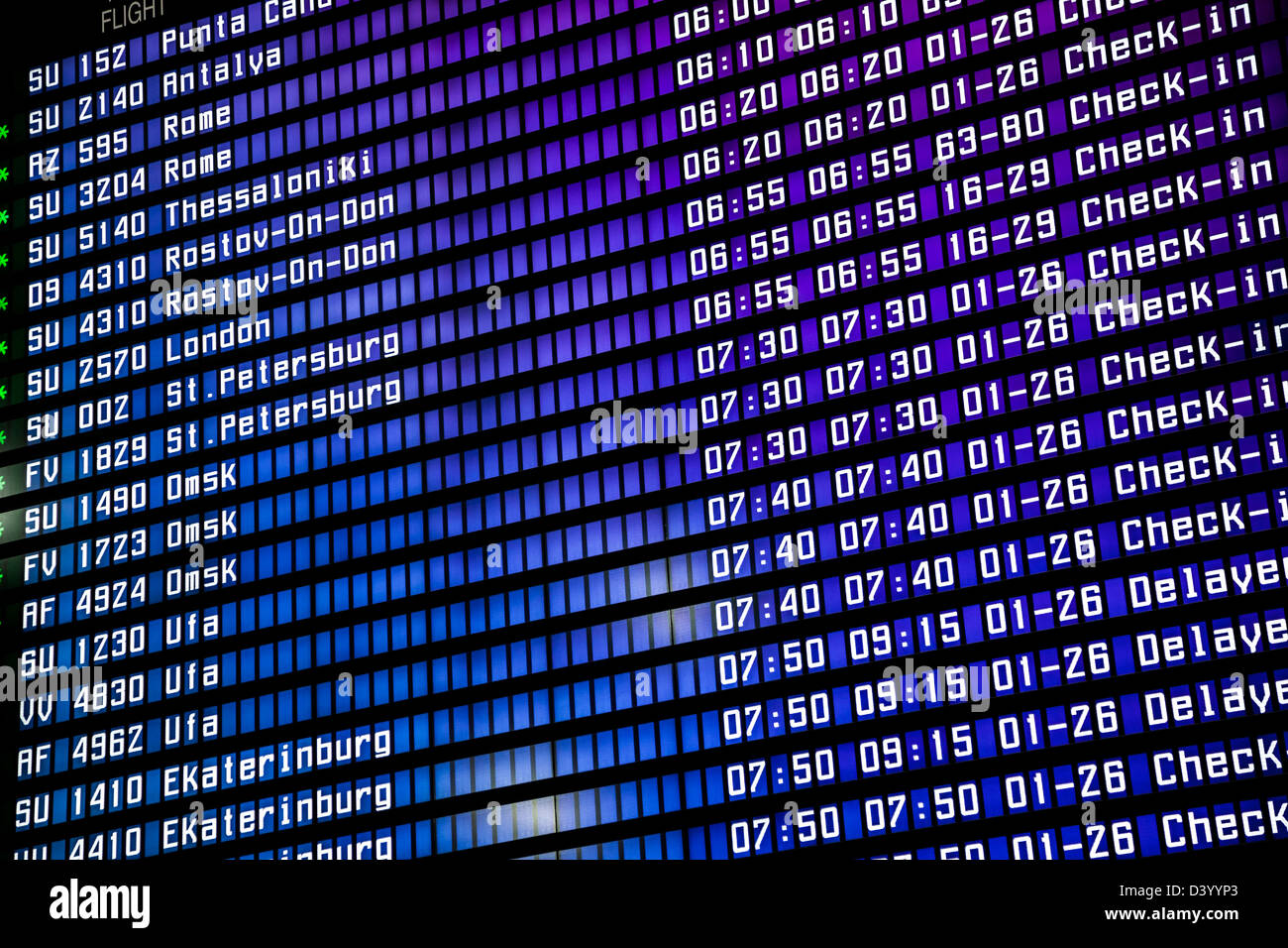Departure schedule board in airport Stock Photo - Alamy