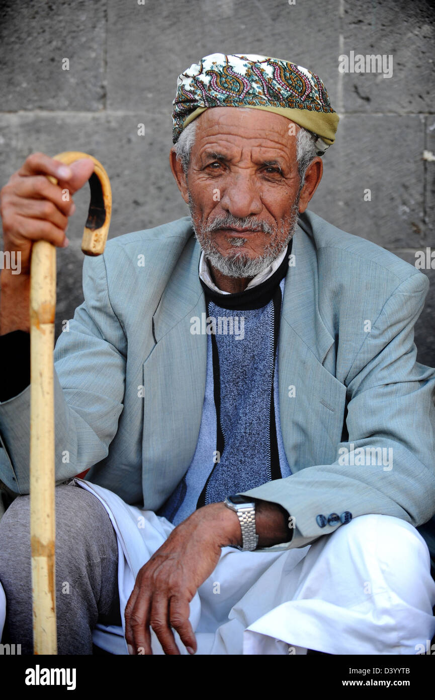 Old Muslim man sitting on the street in Sana'a, capital city of Yemen ...