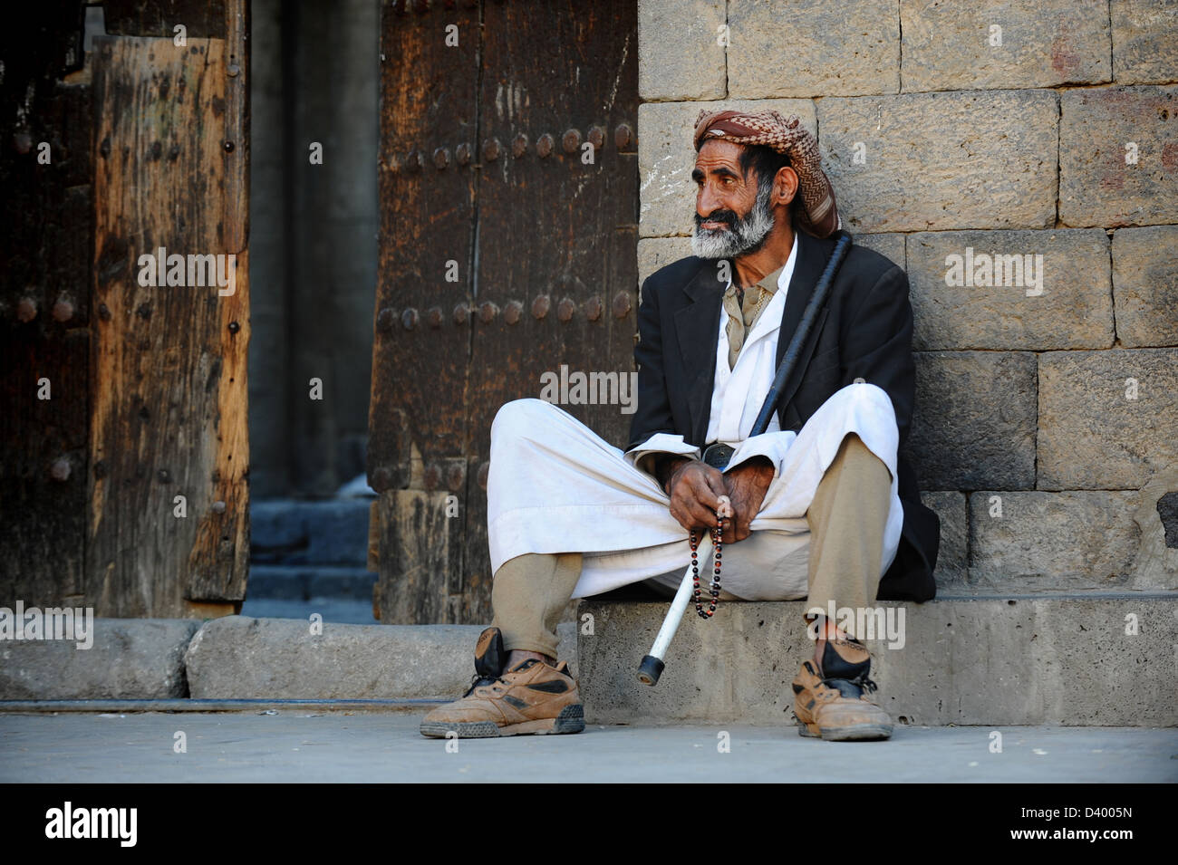 Man in the old part of Sana'a, capital of Yemen wearing traditional ...