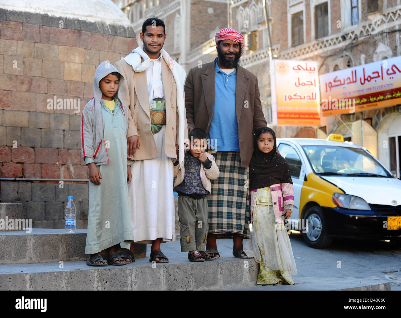 Two Muslim men with their children in Sana'a, capital city of Yemen ...
