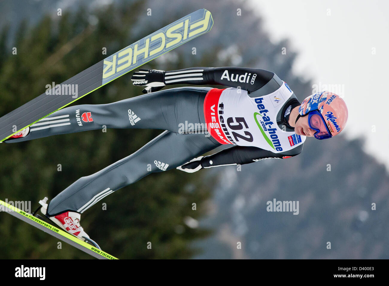 Michael Neumayer of Germany soars through the air during a trial jump ...