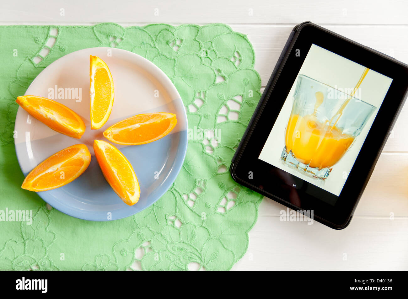 Digital Tablet and Orange slices Stock Photo - Alamy
