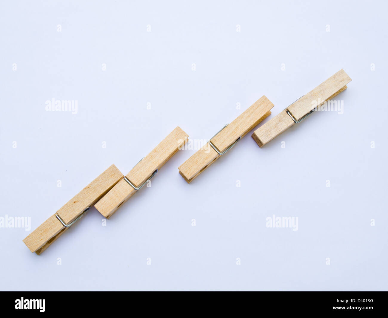 Wooden clothes clips isolated on white background Stock Photo - Alamy