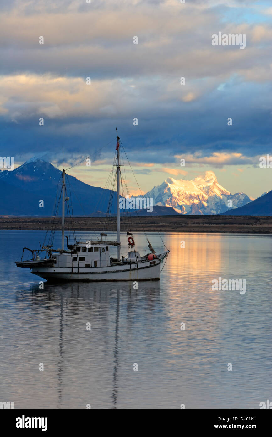 Sailboat on Last Hope Sound, Paine Massif in background, Puerto Natales ...