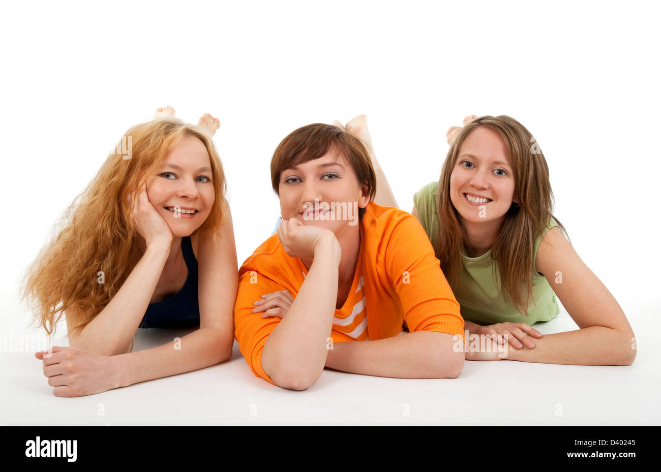 Three smiling friends looking into the camera, relaxing Stock Photo - Alamy