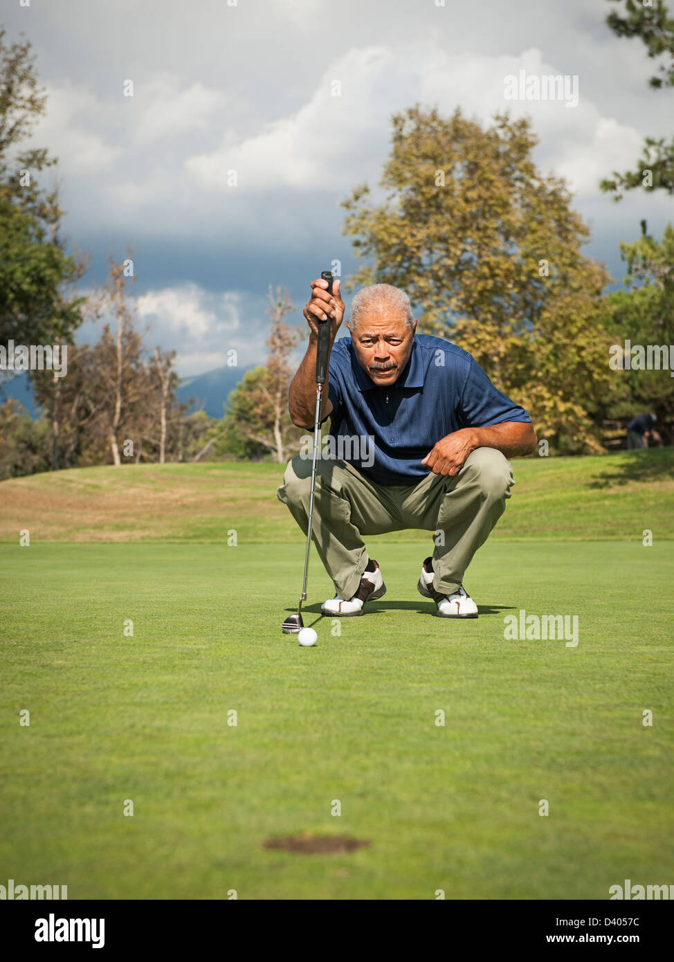 African man holding golf club hi-res stock photography and images - Alamy