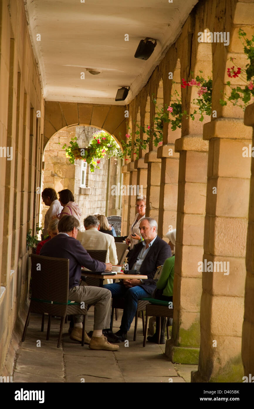 In the colonnade, visitors enjoy a morning coffee at the Tea Room in ...