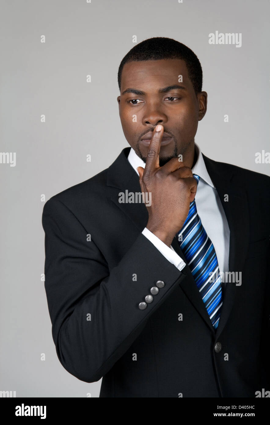 African man finger on lips hi-res stock photography and images - Alamy
