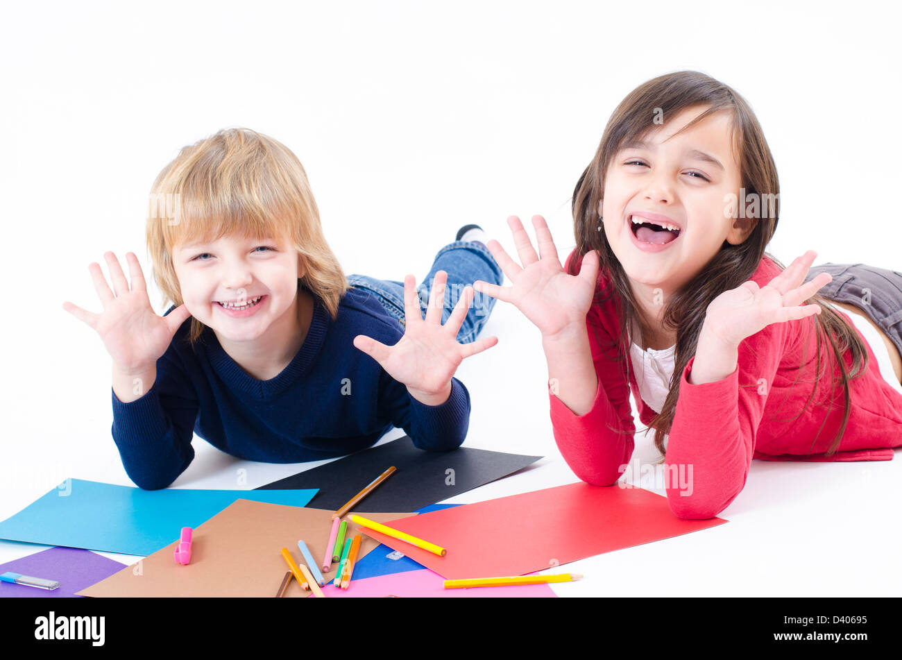 Two happy children doing homework Stock Photo - Alamy