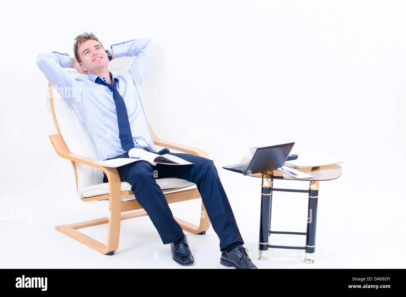 A happy business man at his office Stock Photo - Alamy
