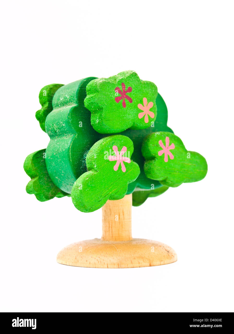 A handmade wooden tree toy isolated on white background Stock Photo - Alamy