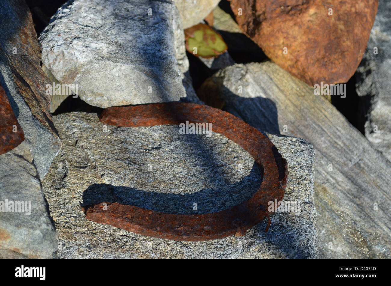 Old rusty horseshoe left on rock wall Stock Photo - Alamy