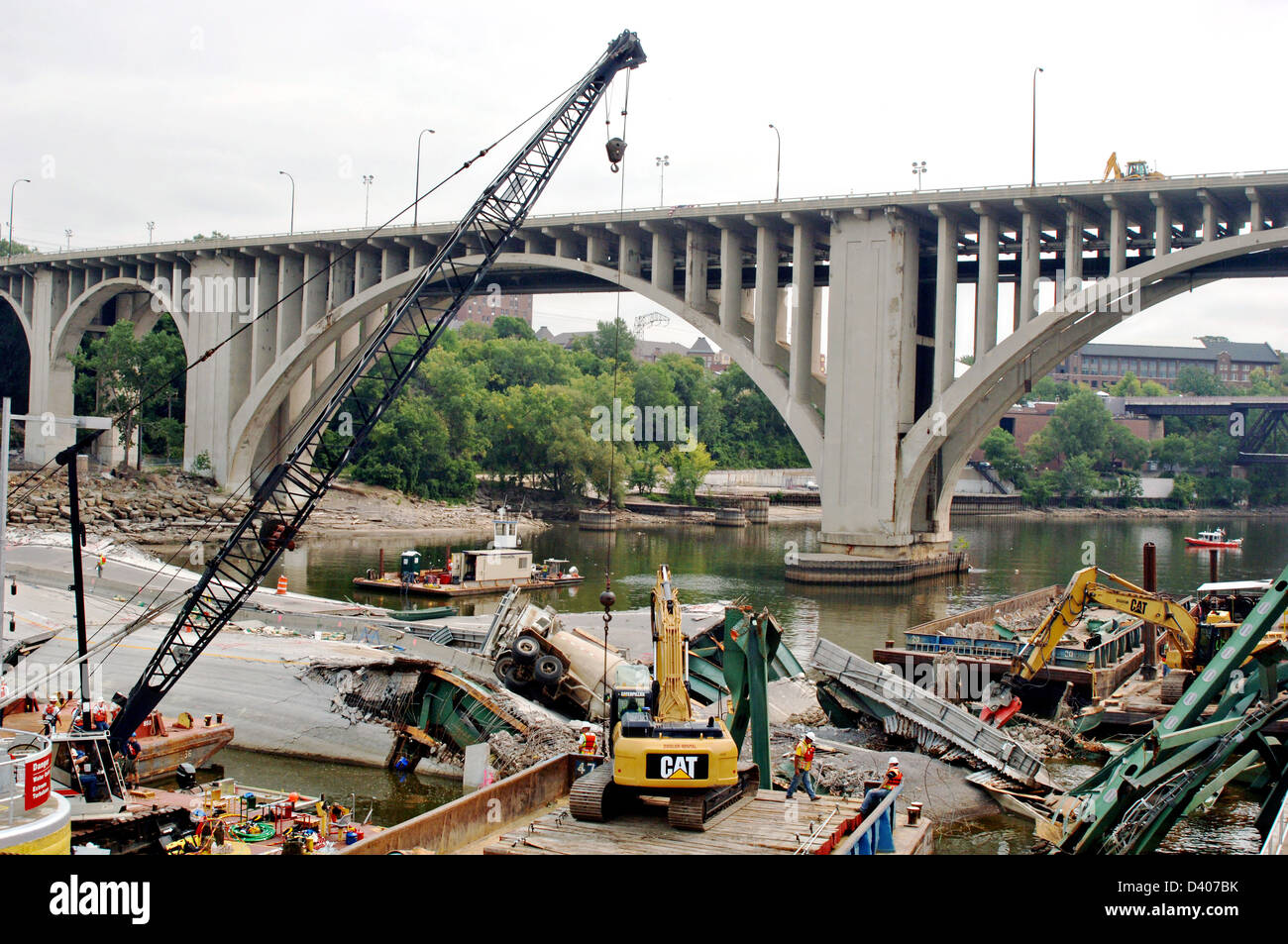 View of the remains of the I-35 bridge collapse and recovery efforts ...